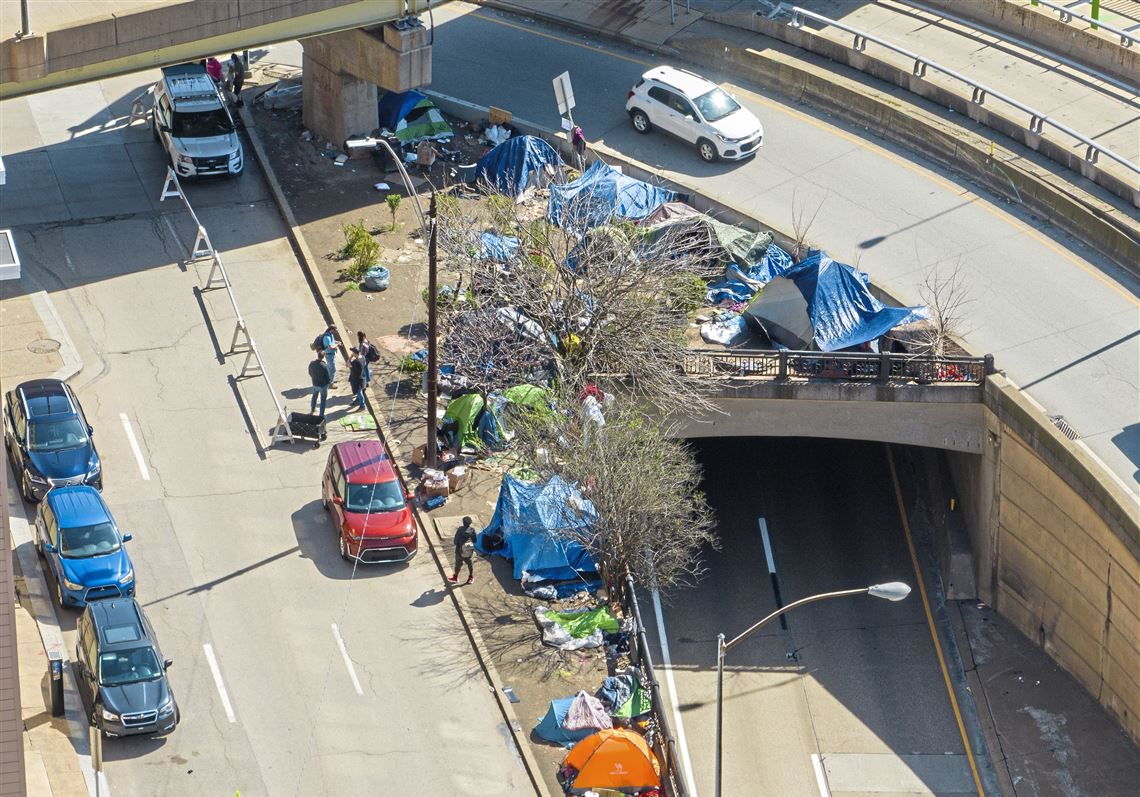 City officials begin removing Downtown Pittsburgh homeless encampment ...